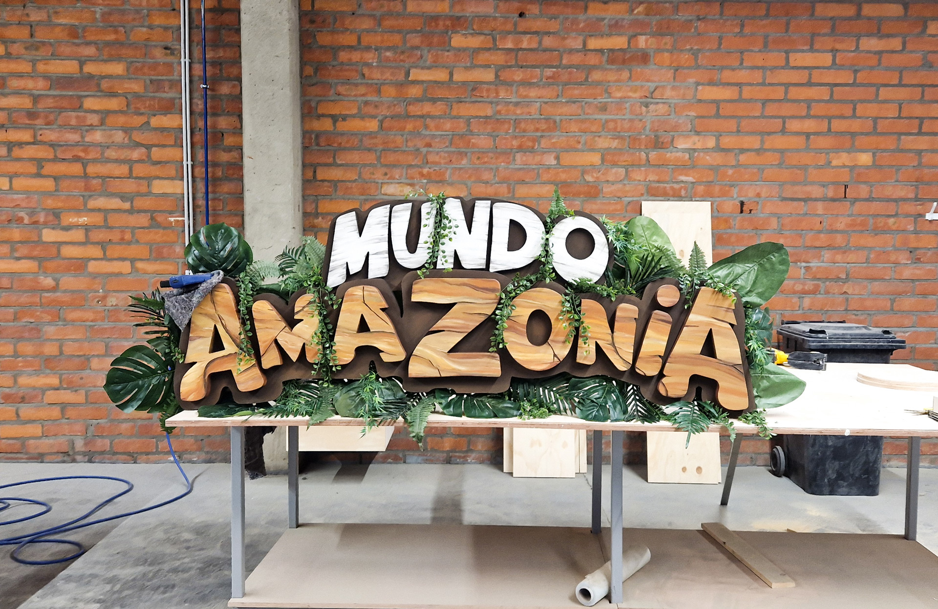 We design, we create, we produce - Amazonia sign by Kabuki